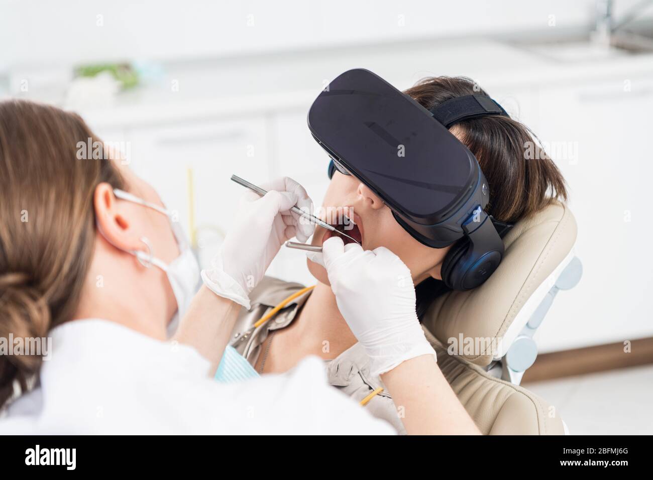 A modern teeth checkup at the Dentist's office Stock Photo - Alamy