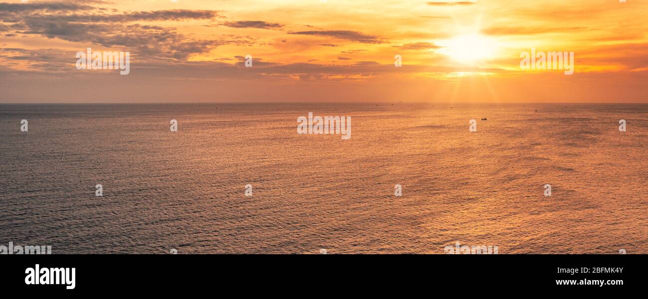 Panorama of Sunset over horizon on tropical sea with boat Stock Photo ...
