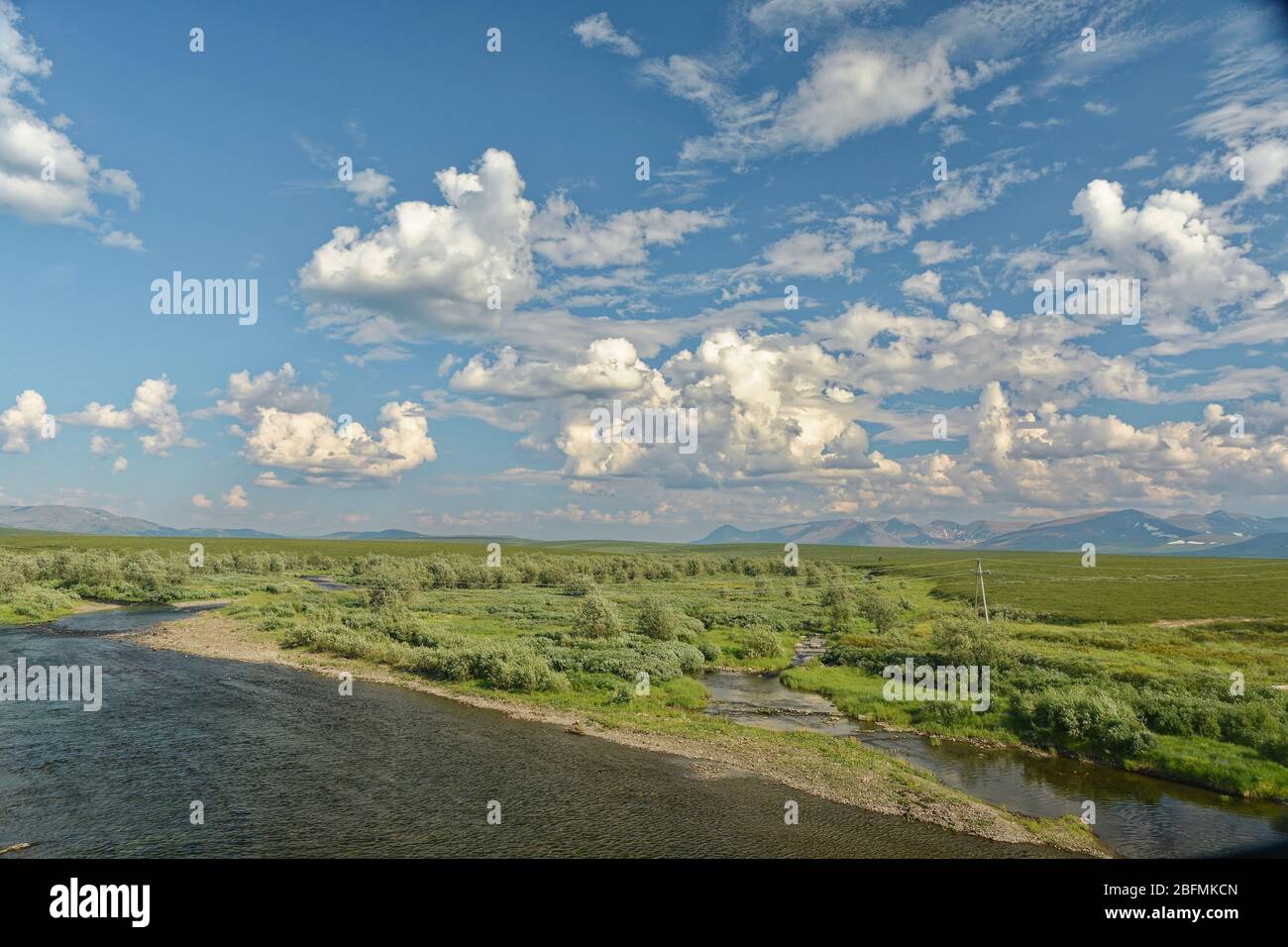 Tundra in the foothills of the Polar Urals. View of the Main Ural ridge ...