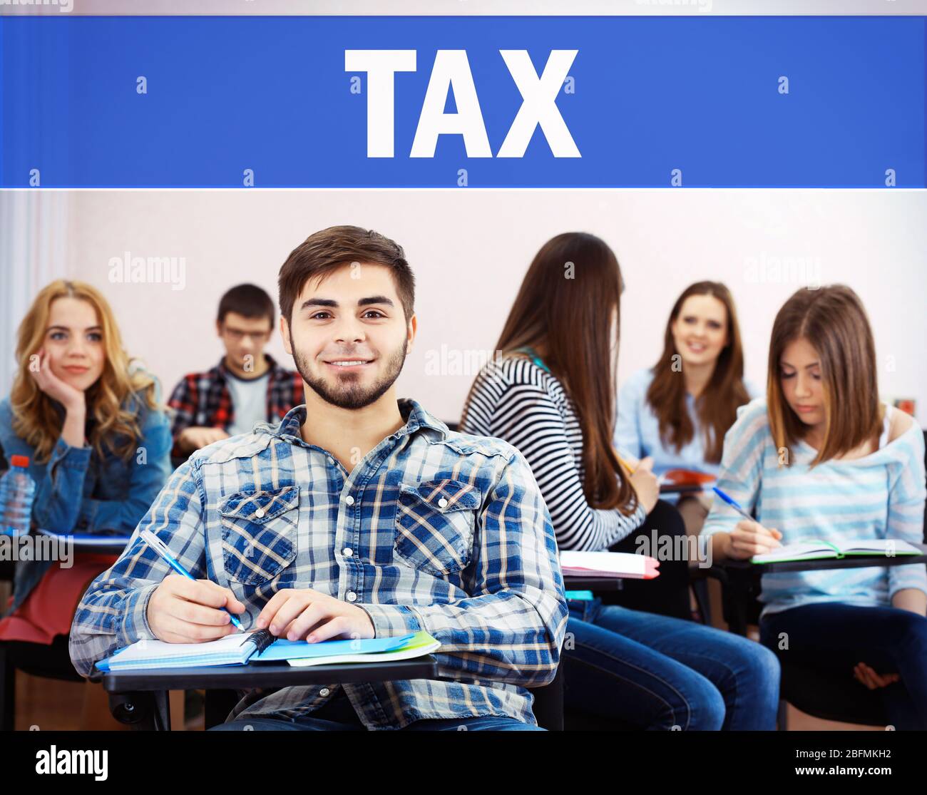 Tax concept. Group of students sitting in classroom Stock Photo - Alamy