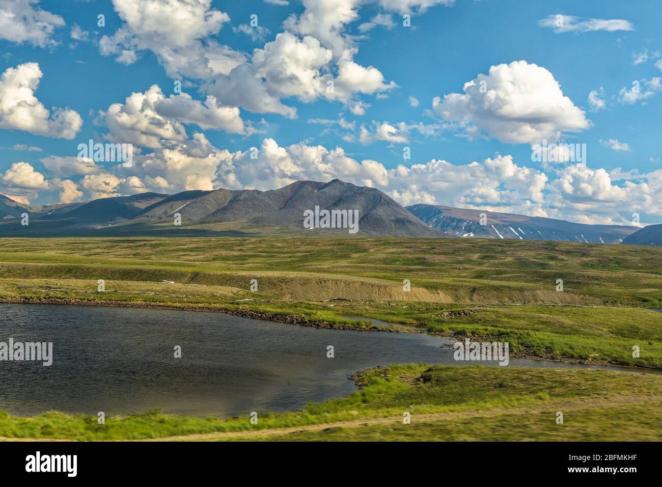 Tundra in the foothills of the Polar Urals. View of the Main Ural ridge ...