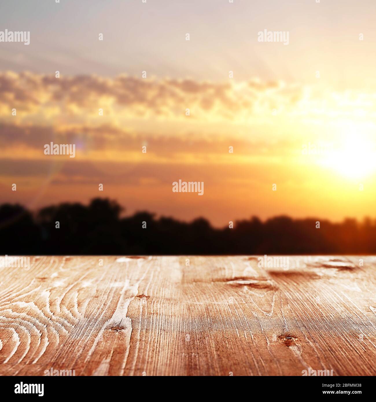 Wooden table on blurred nature background Stock Photo - Alamy