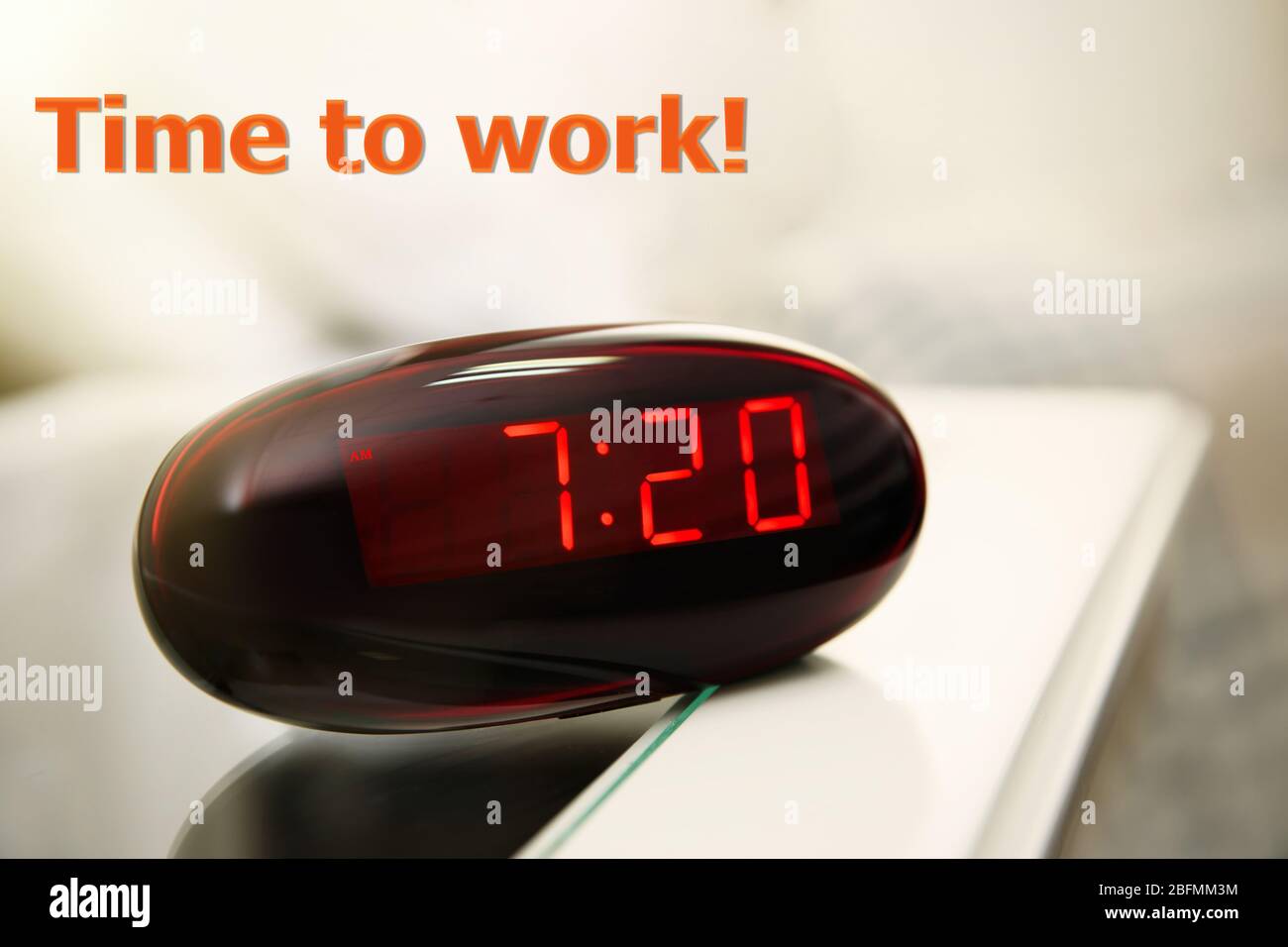 Digital clock showing 7:20 o'clock on a bedside table in bedroom Stock ...