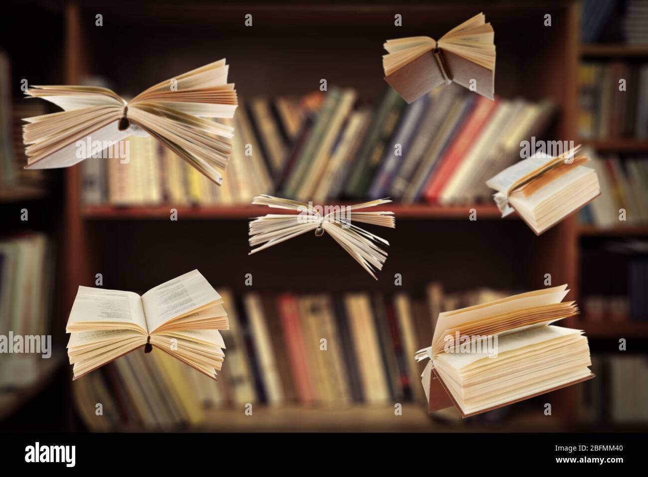 Open flying old books hi-res stock photography and images - Alamy