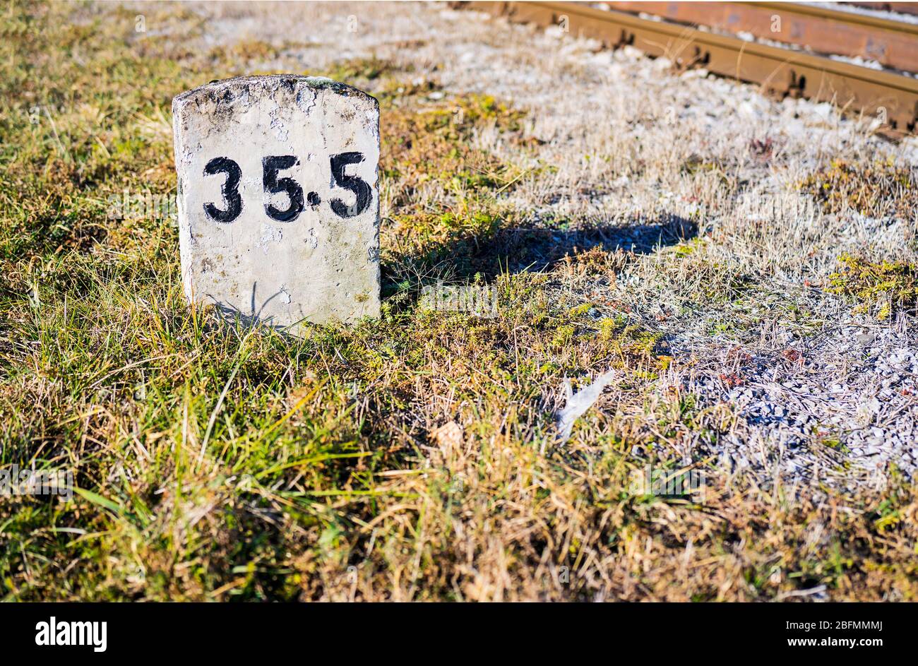 Railroad stone mark with a number Stock Photo - Alamy