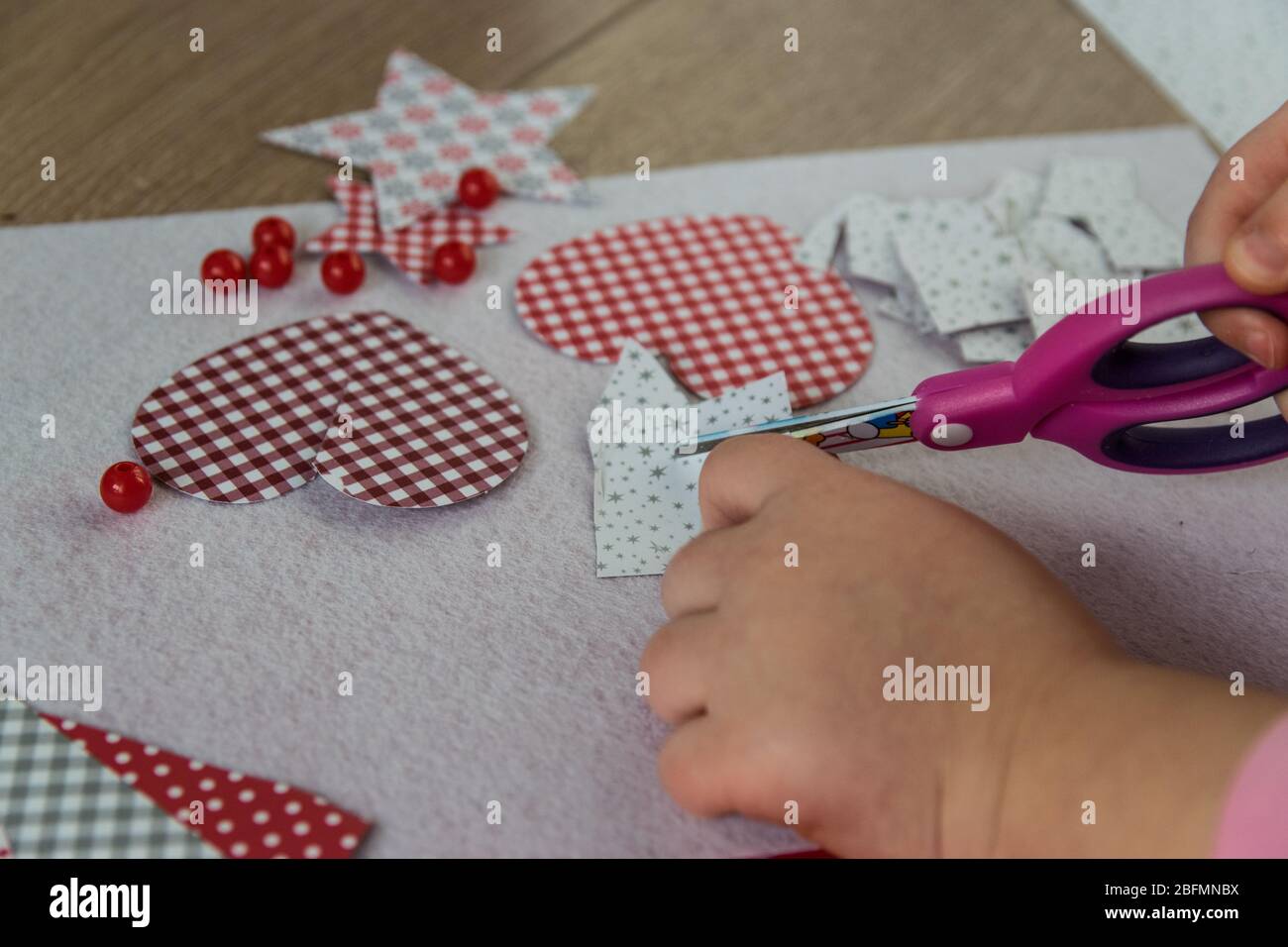 The hand of the child make greeting card with heart. Hobby concept ...