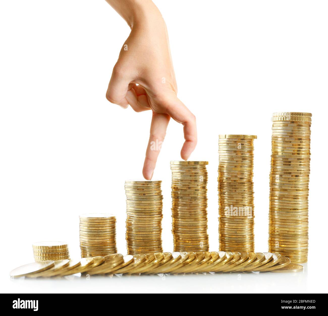 Financial success concept. Female fingers going up of coins, isolated ...