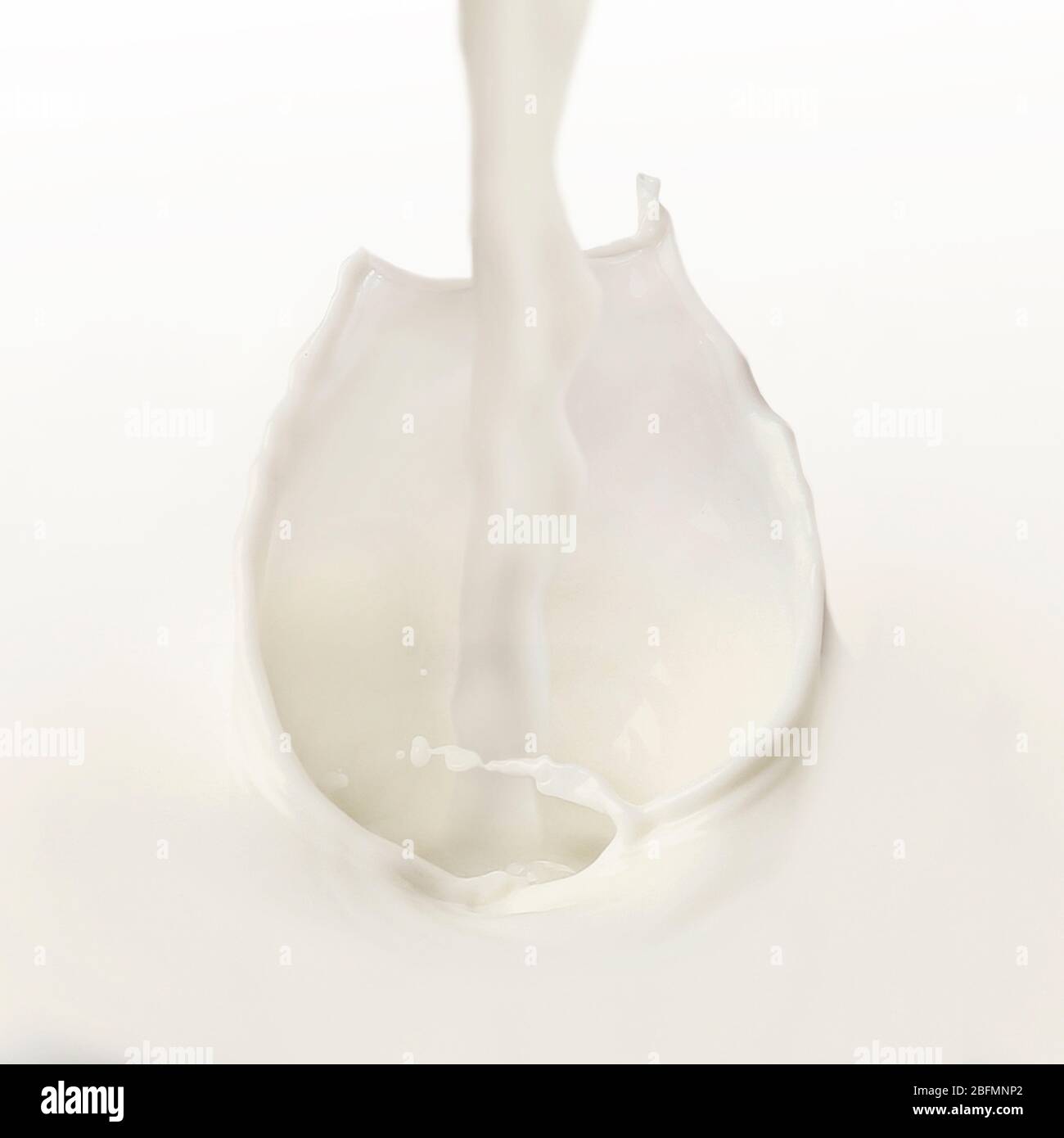 Milk splash isolated on white Stock Photo - Alamy