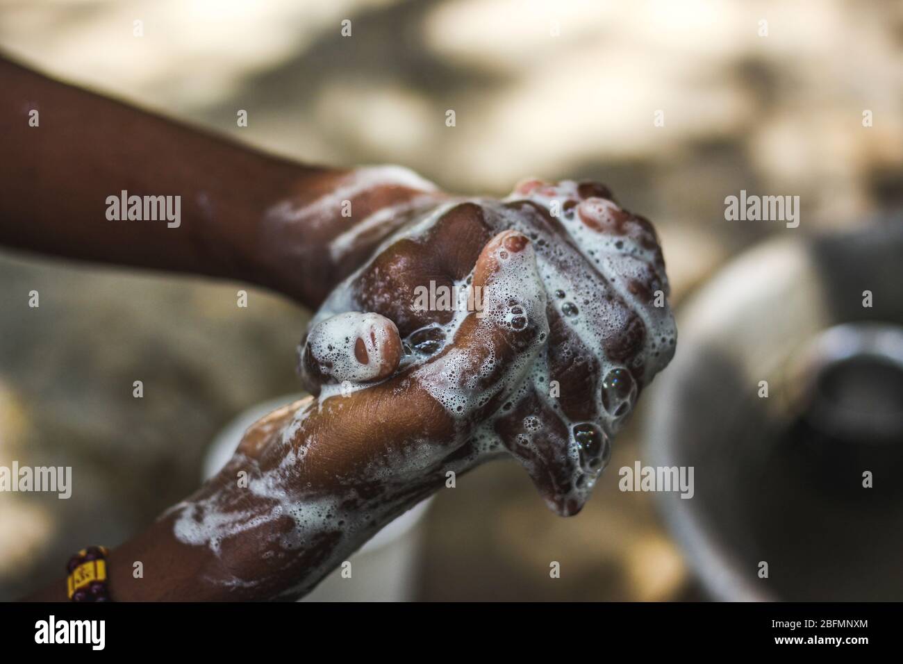 Washing hands.Man washing his hands in the garden at home.Coronavirus ...