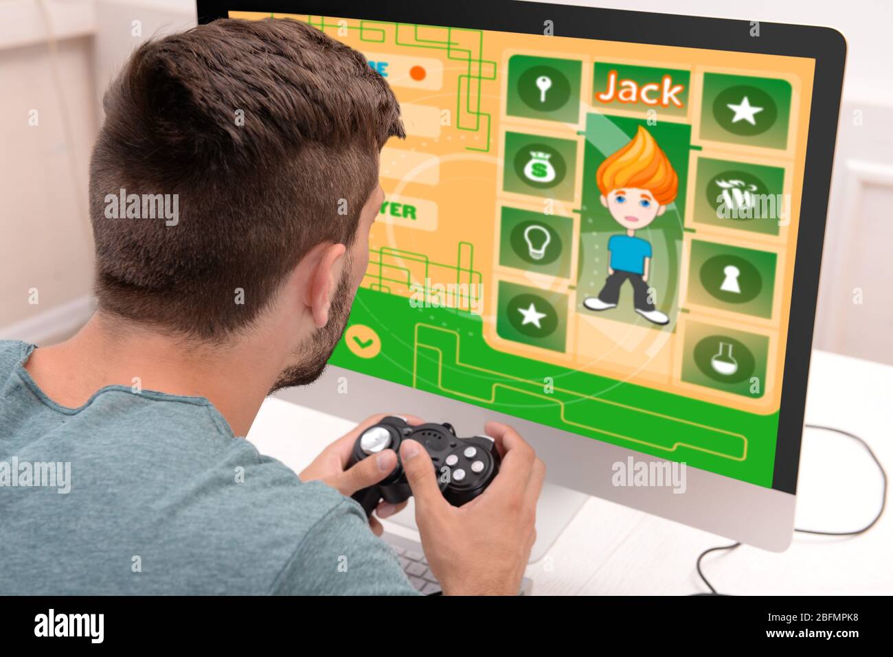 Young man playing computer games at home Stock Photo - Alamy