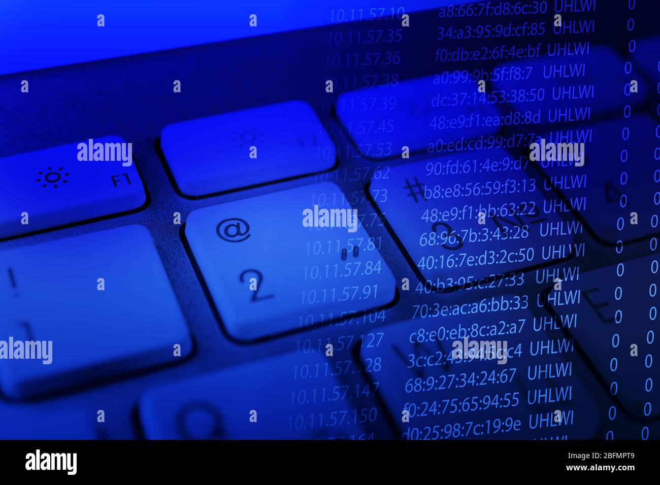 Computer keyboard with program code Stock Photo - Alamy
