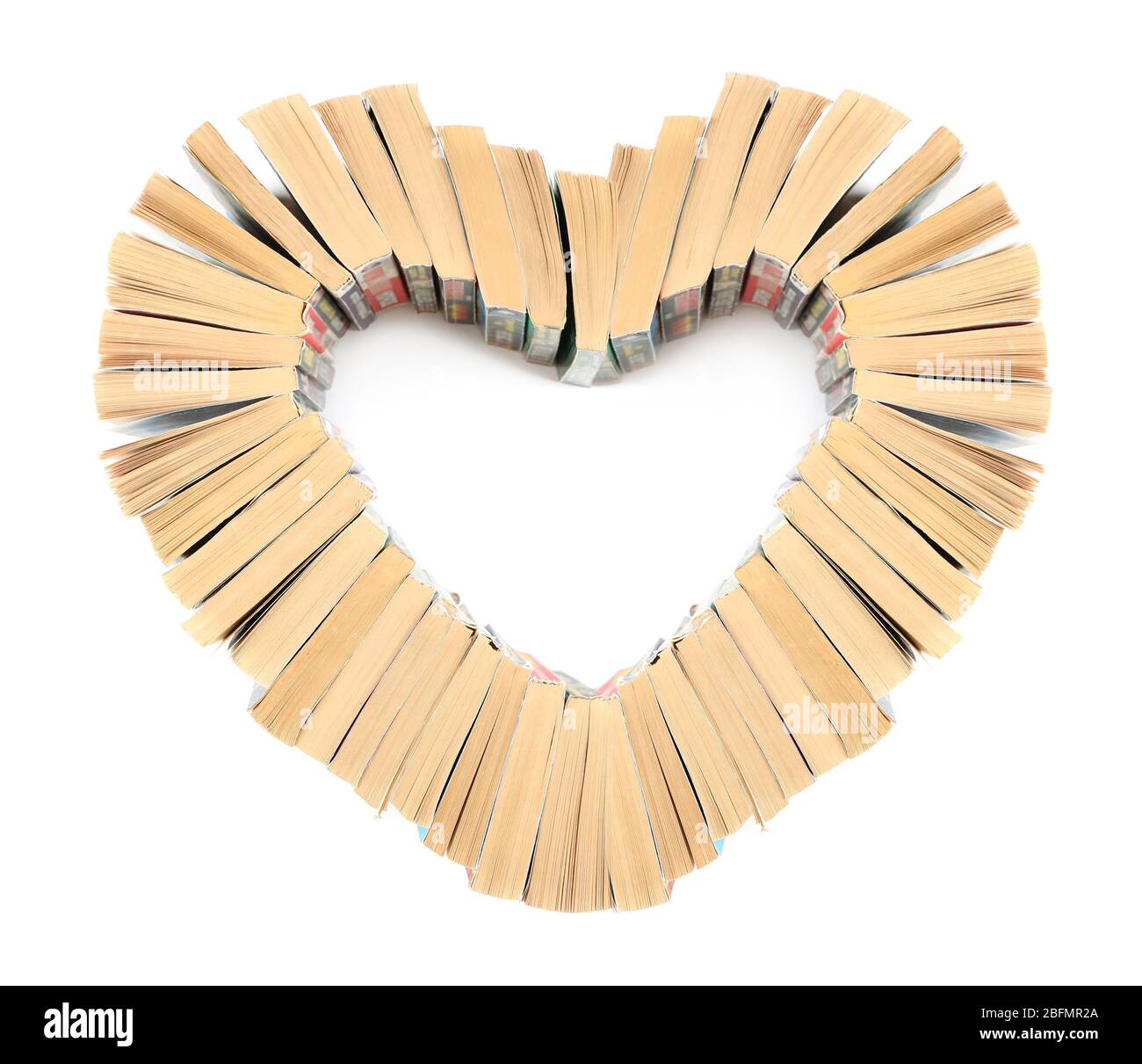 The heart of books isolated in white Stock Photo - Alamy