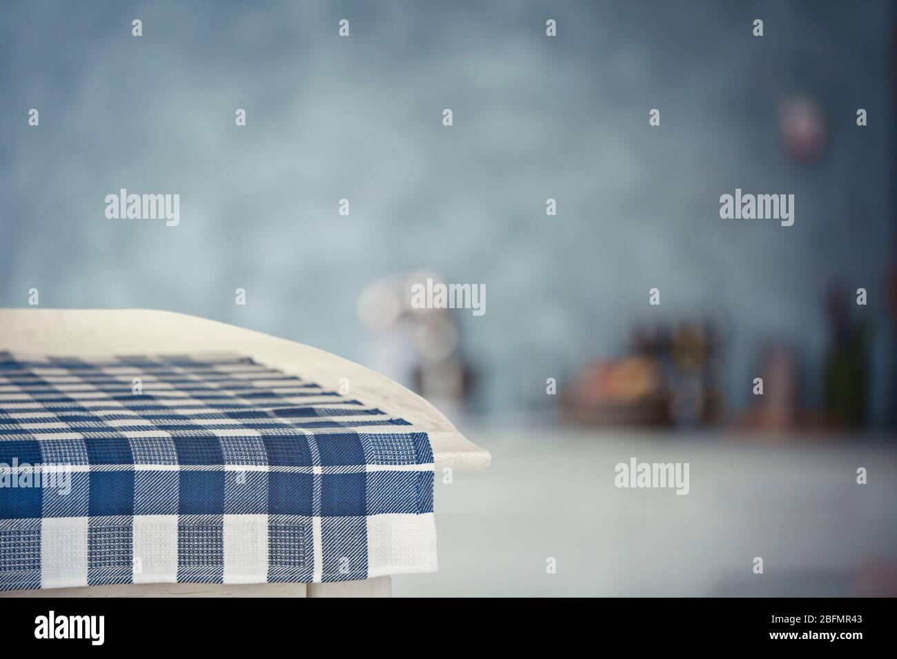 Wooden table and blurred kitchen background Stock Photo - Alamy