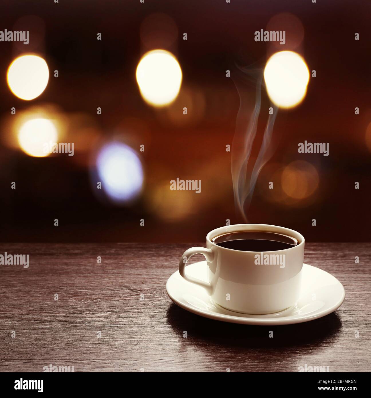 Cup of coffee on table on blured cafe background Stock Photo - Alamy