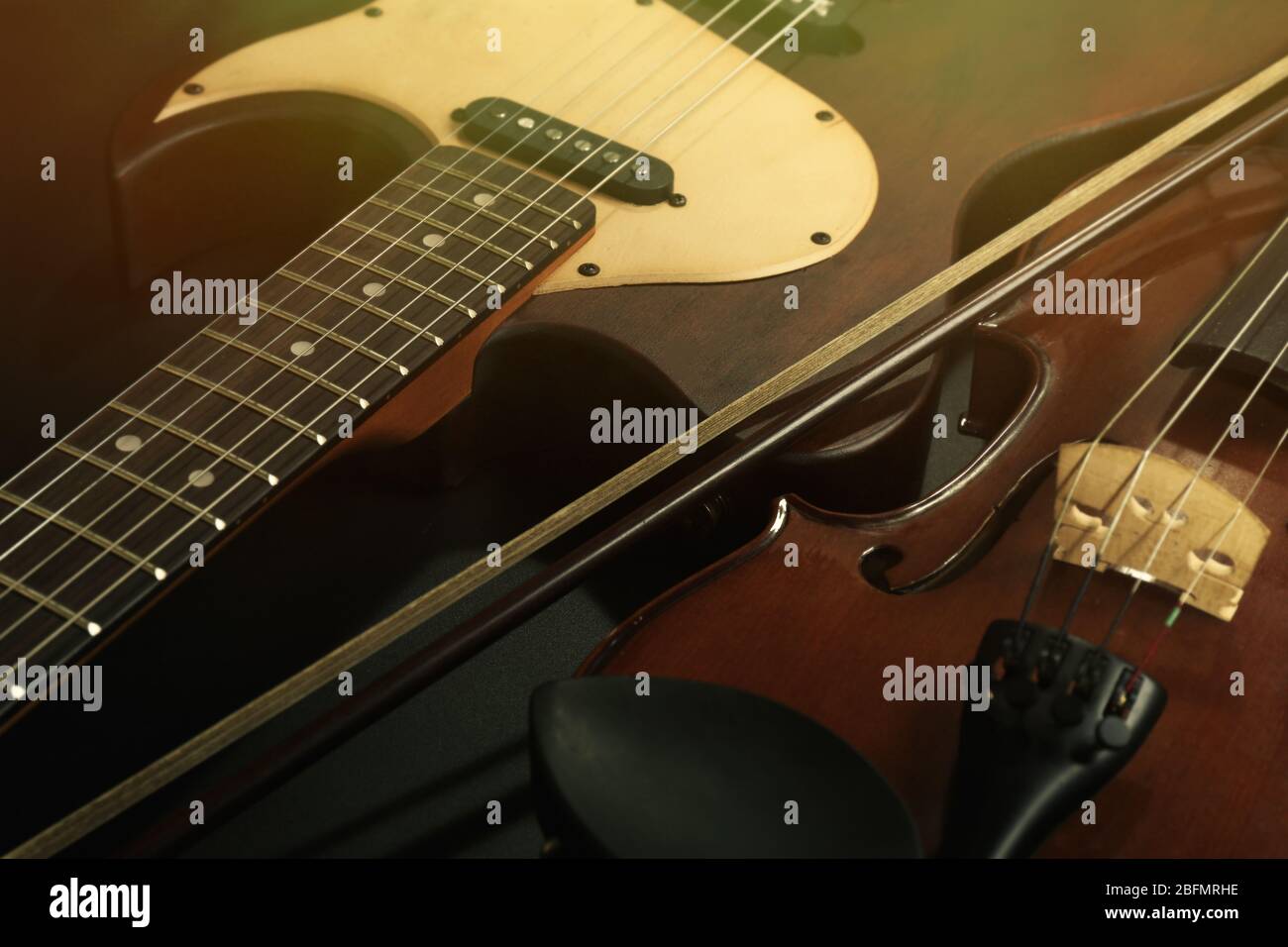 Electric guitar and violin, close-up Stock Photo - Alamy
