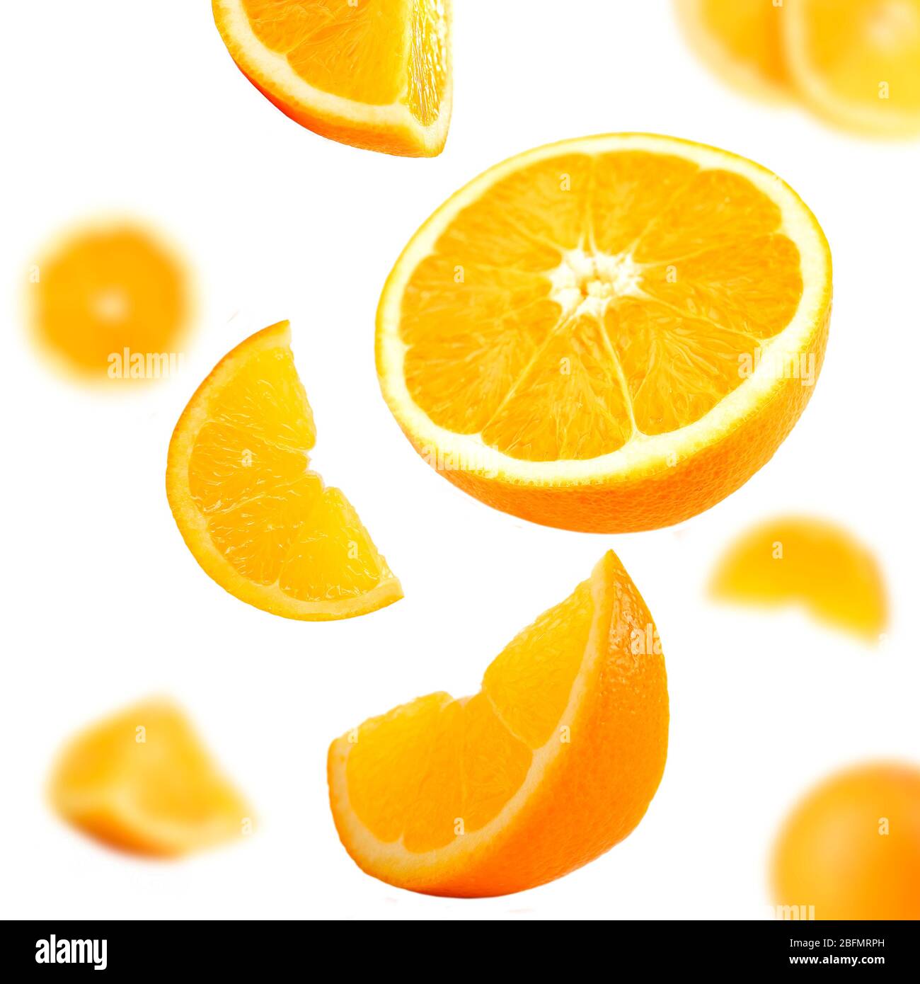 Falling ripe oranges isolated on white Stock Photo - Alamy