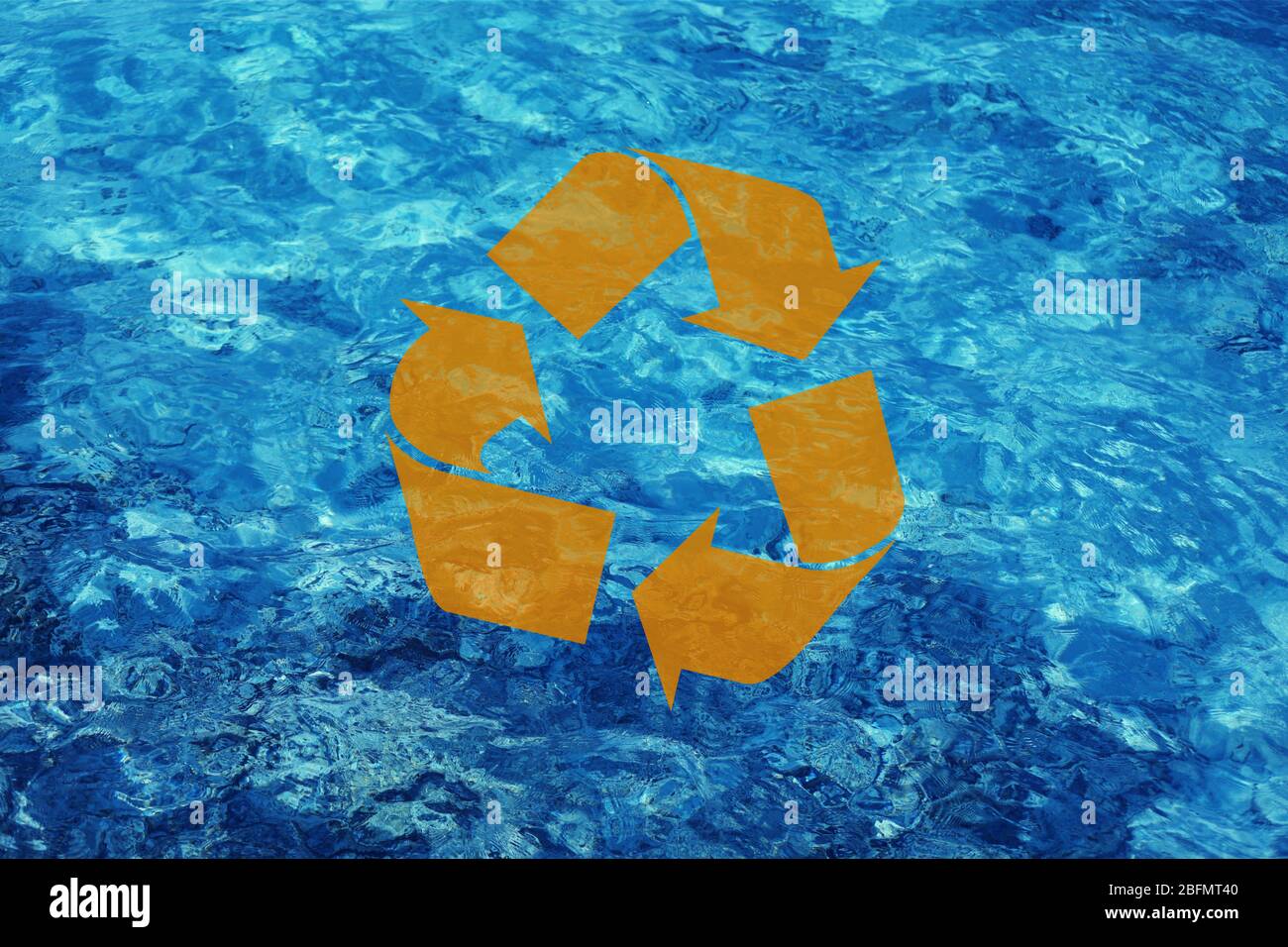 Recycling symbol on water background Stock Photo - Alamy