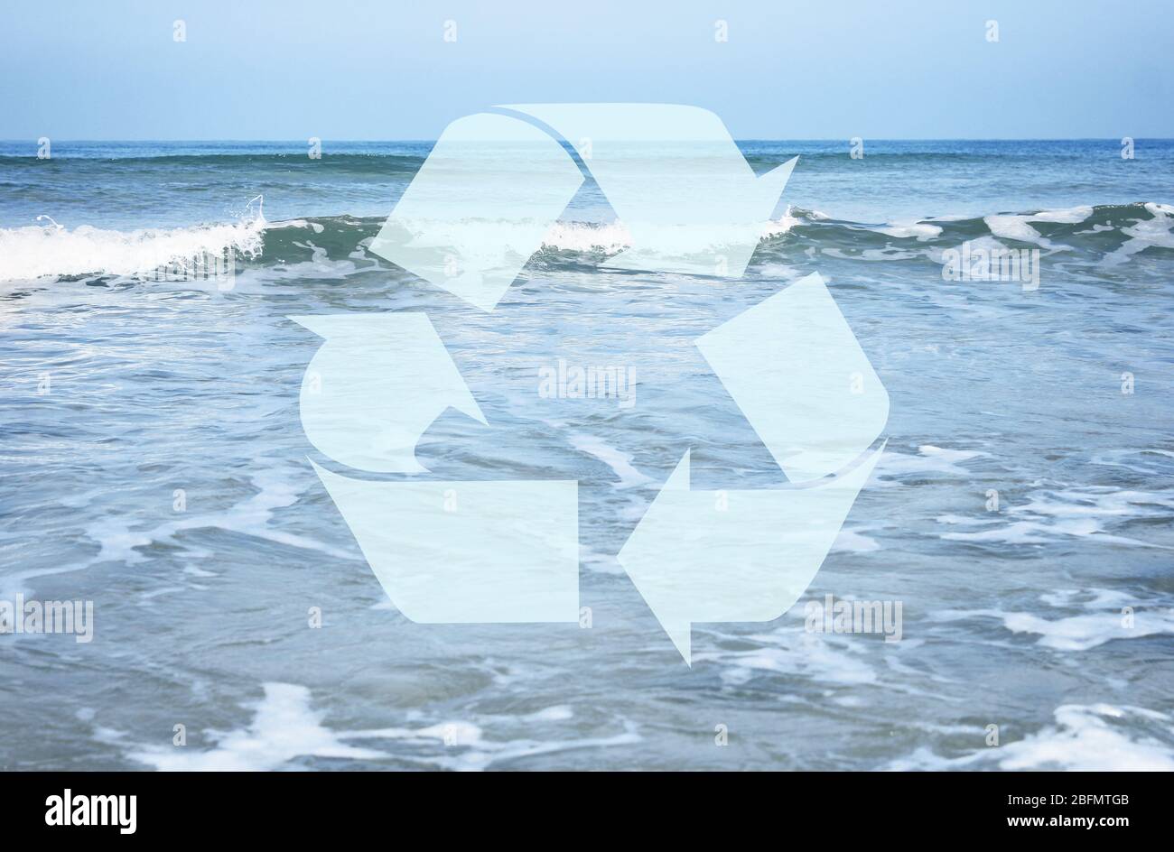 Recycling symbol on water background Stock Photo - Alamy