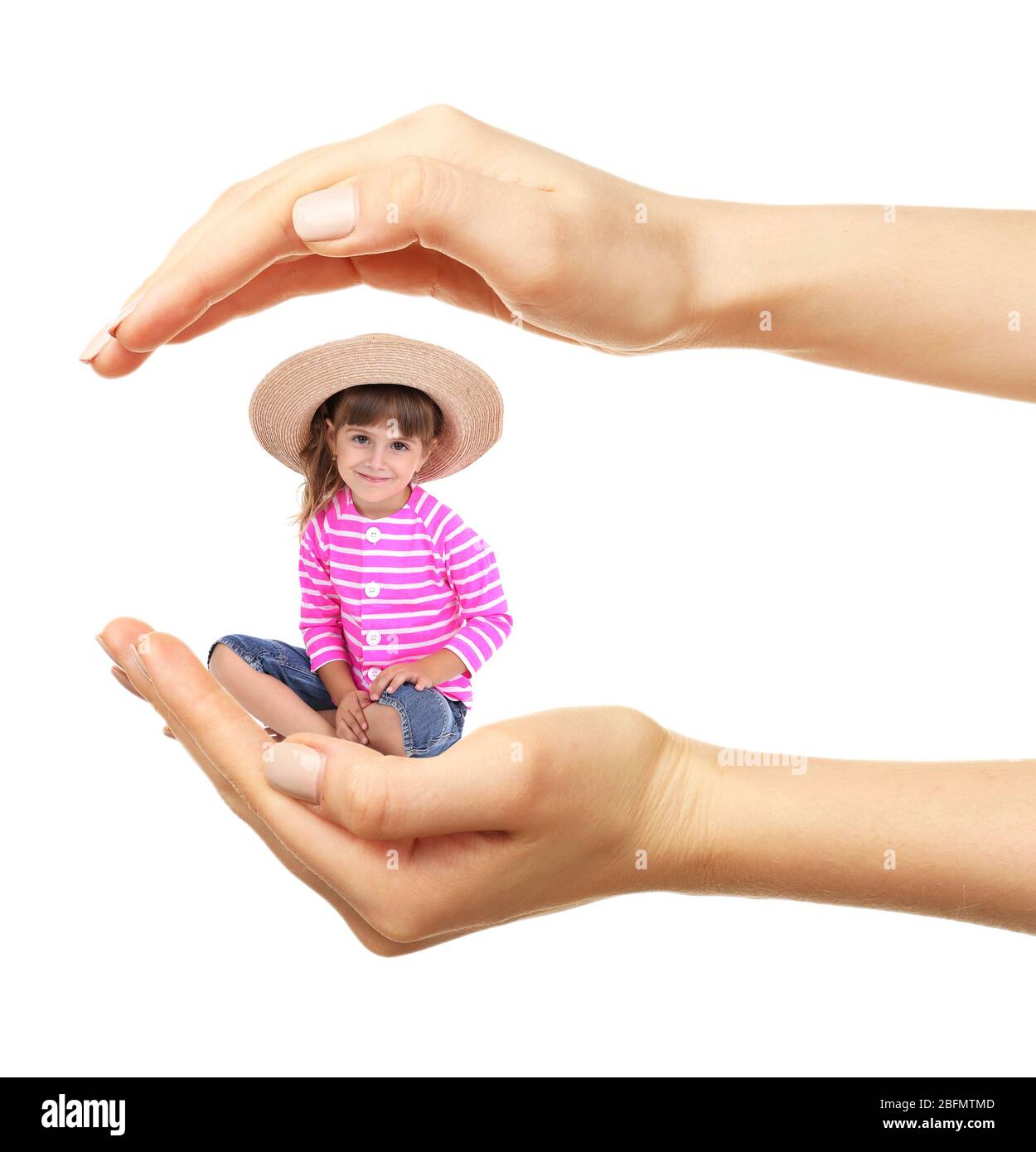 Little girl sitting on hand isolated on white Stock Photo - Alamy