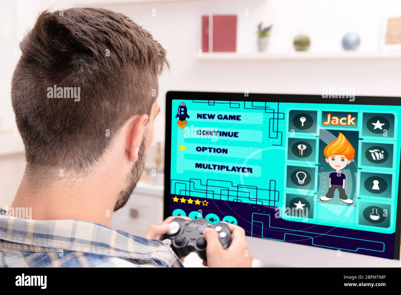 Young man playing computer games at home Stock Photo - Alamy