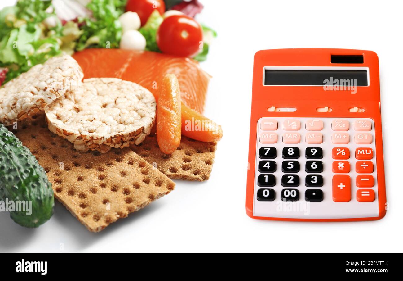 Calculator and healthy food set isolated on white Stock Photo - Alamy