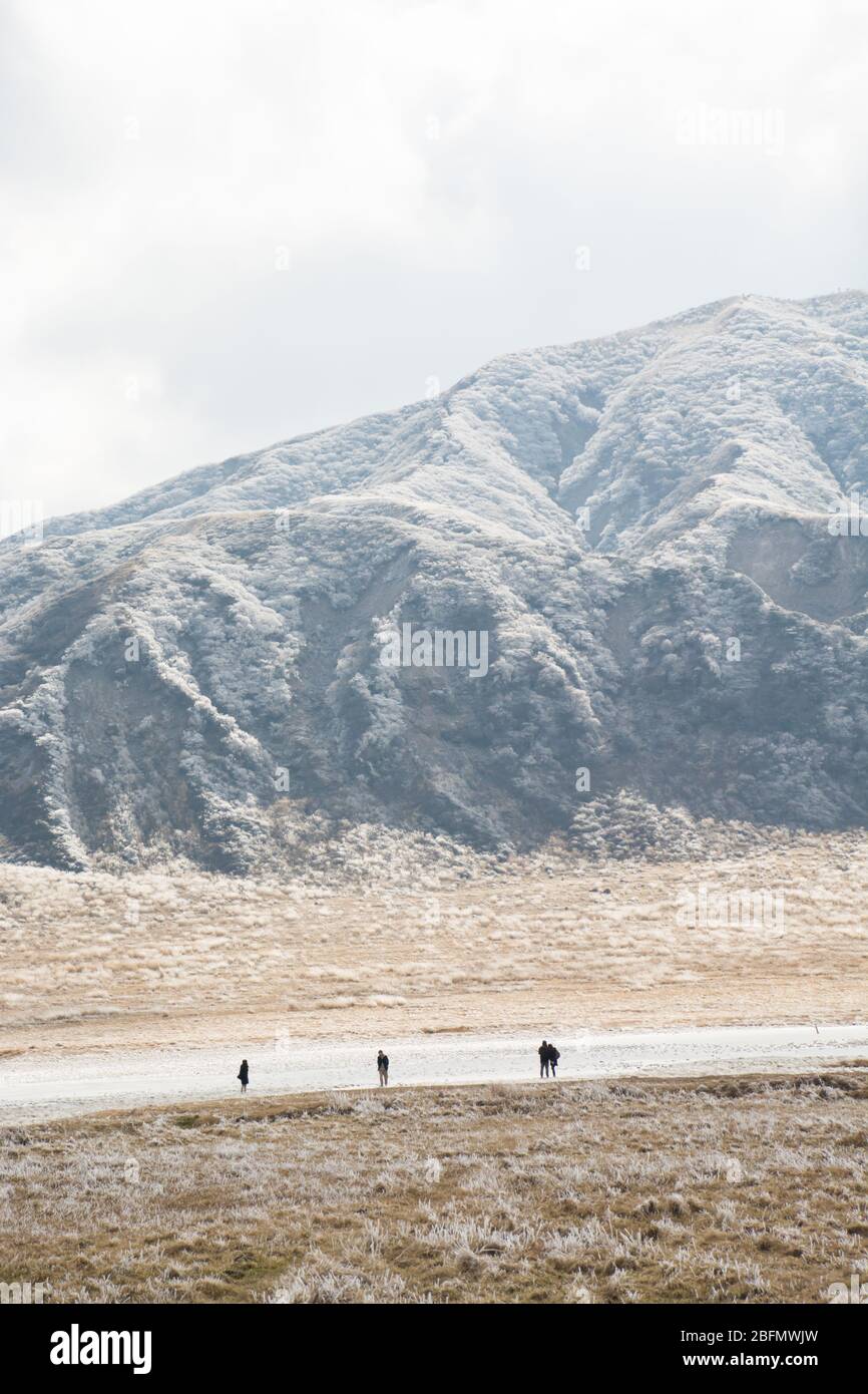 Mount Aso and Kusasenri in winter. covered by golden yellow grassland - Kumamoto, Japan Stock ...
