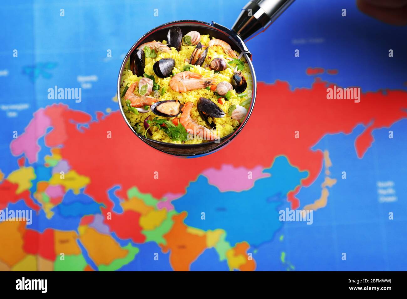 Popular food concept. Looking for seafood paella on world map Stock ...