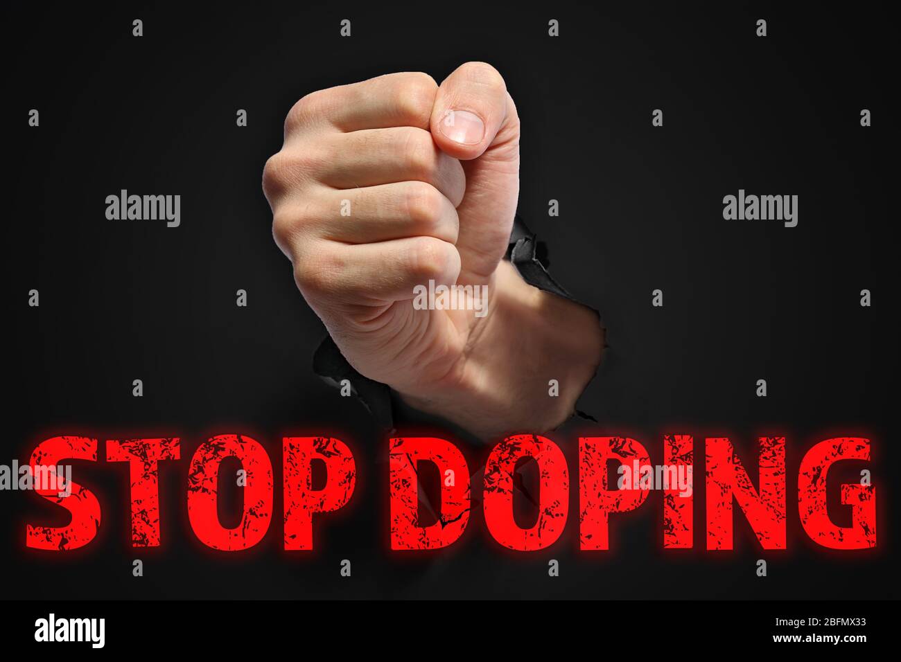 Stop doping concept. Man fist punching through black paper Stock Photo ...