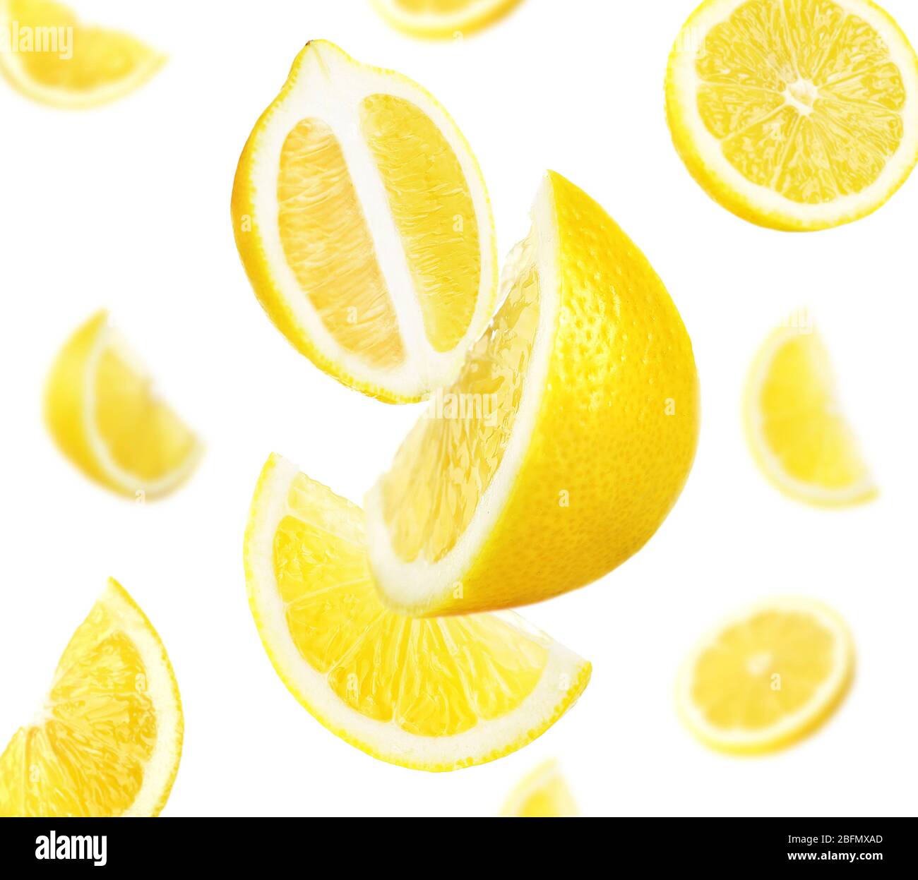 Sliced ripe lemon falling on hi-res stock photography and images - Alamy