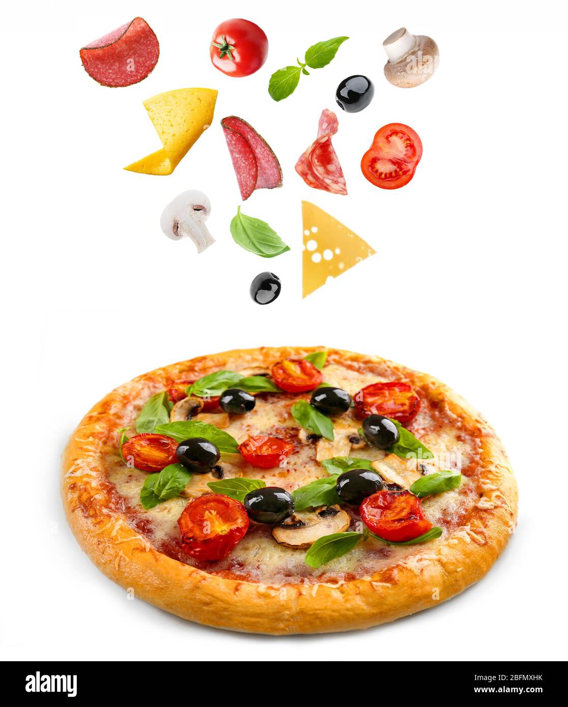 Delicious pizza and falling ingredients isolated on white Stock Photo ...