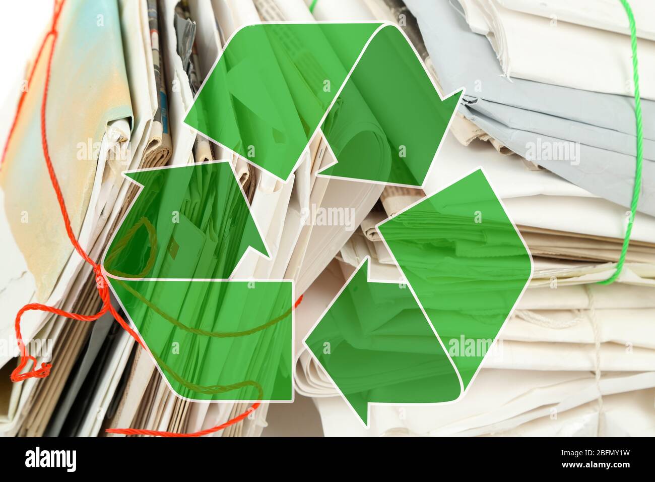 Big stack of papers and recycle sign Stock Photo - Alamy