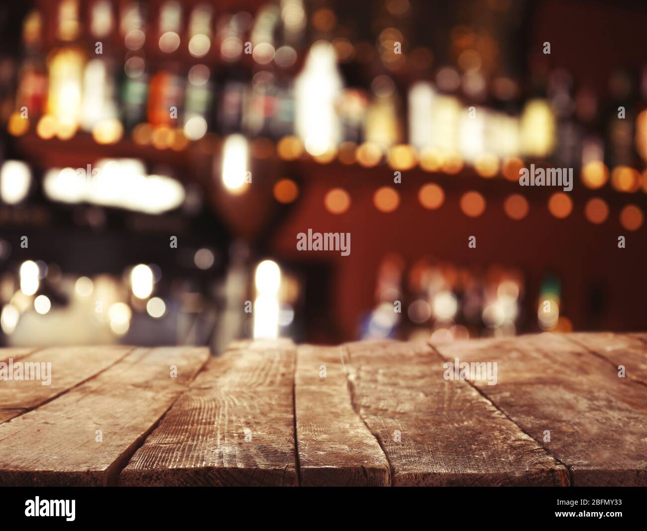 Empty wooden table and bokeh pub, bar of restaurant background Stock ...