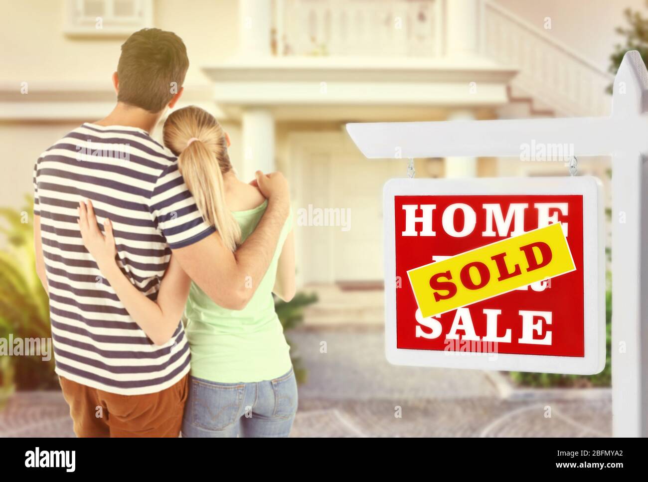 Loving couple looking at their dream house Stock Photo - Alamy