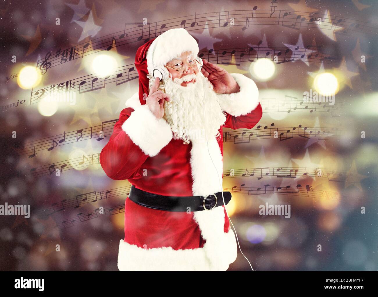 Santa Claus listening to music with headphones against abstract ...