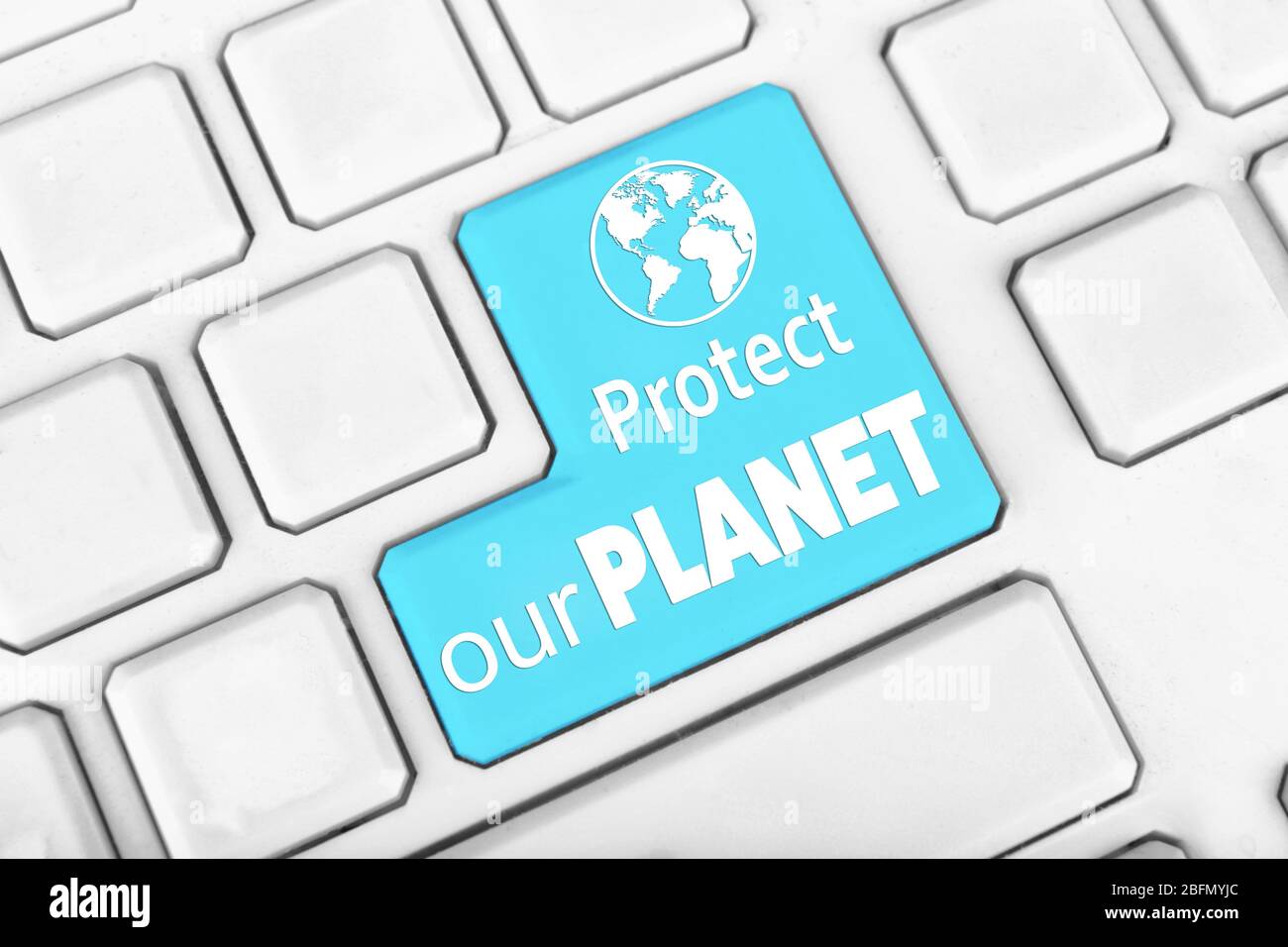 Close-up of laptop keyboard with color button and text Protect Our ...