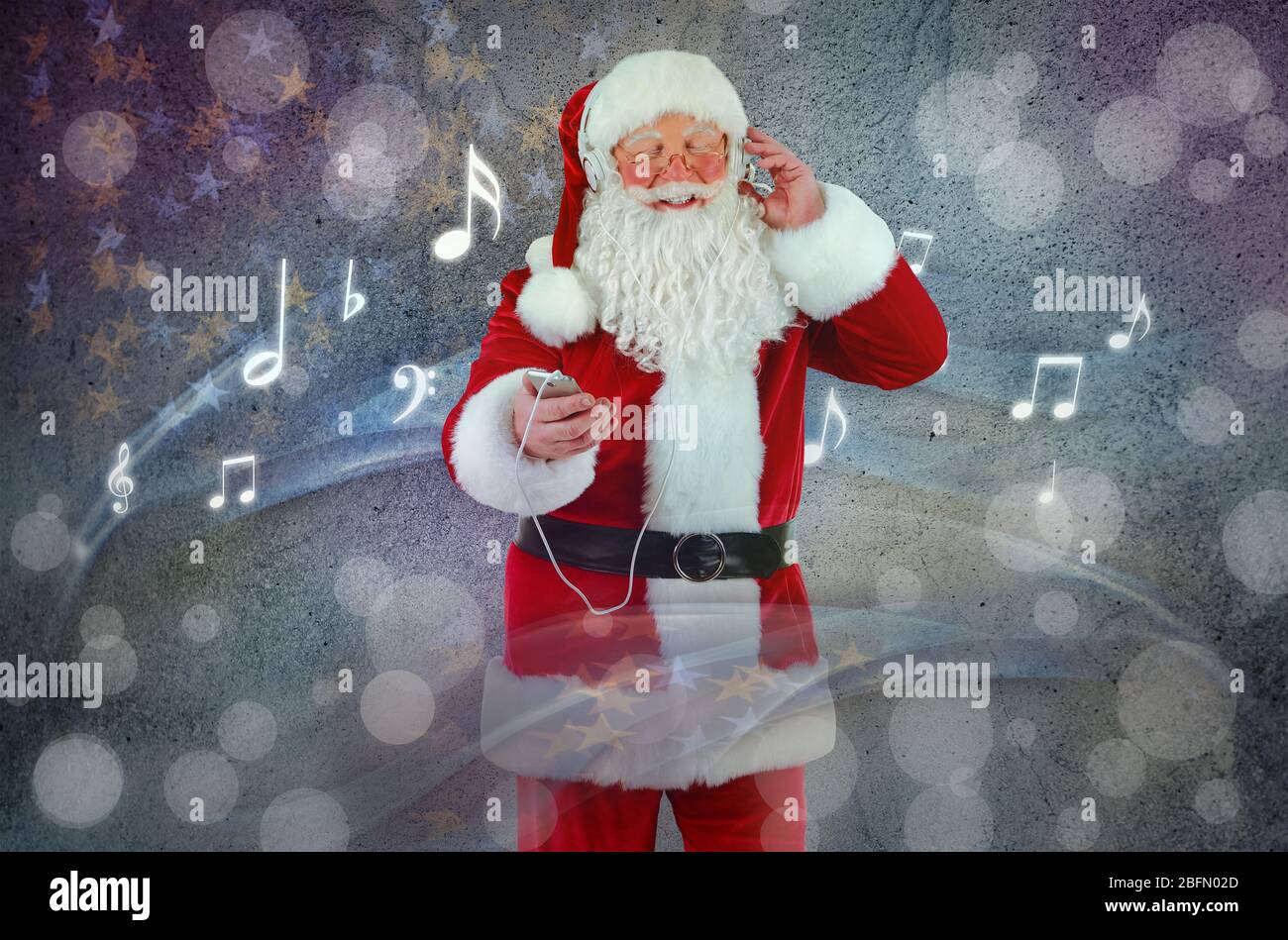 Santa Claus with headphones listening to music against abstract musical ...
