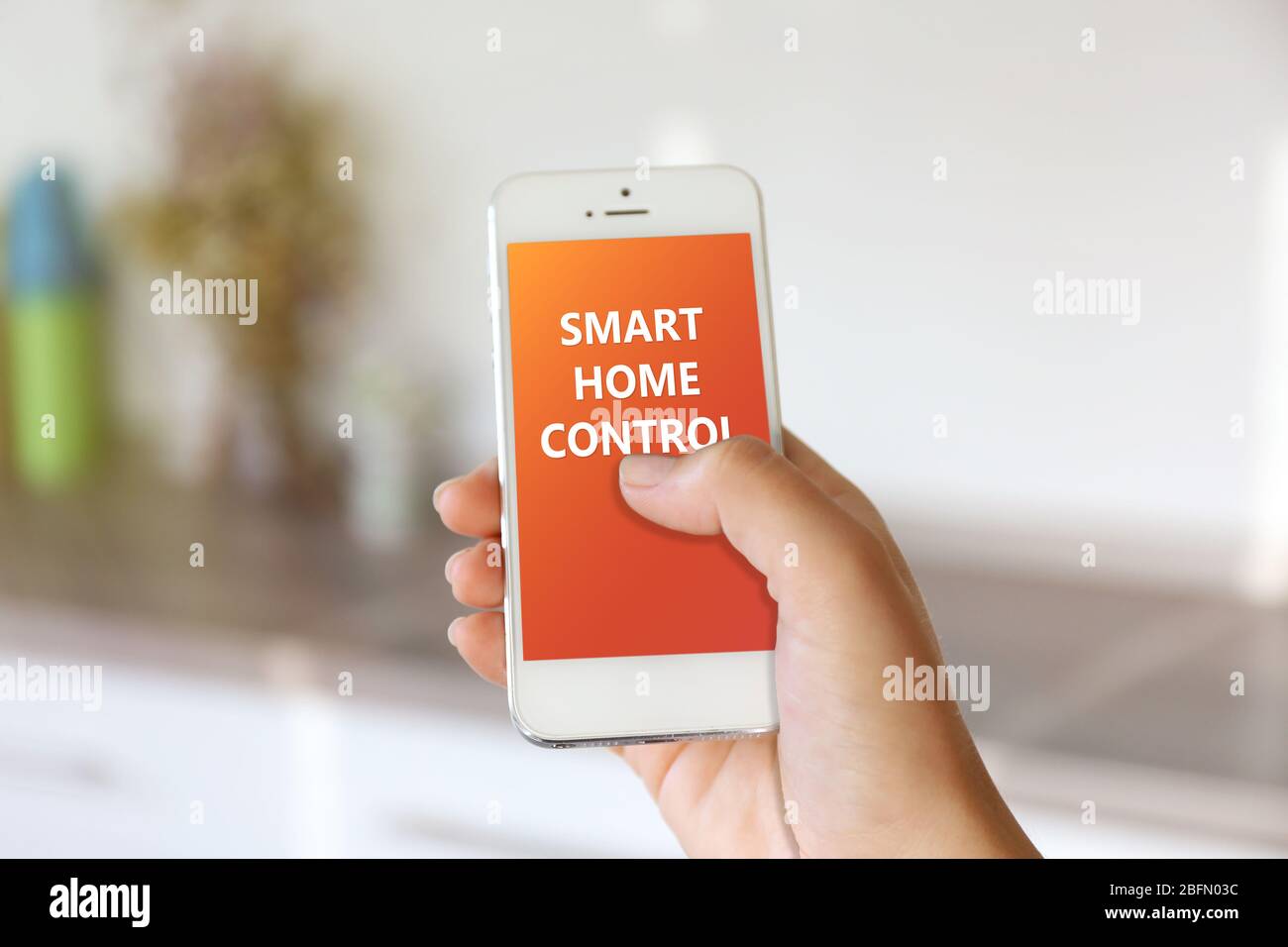 Using smart home app on phone. Smart home control concept Stock Photo ...