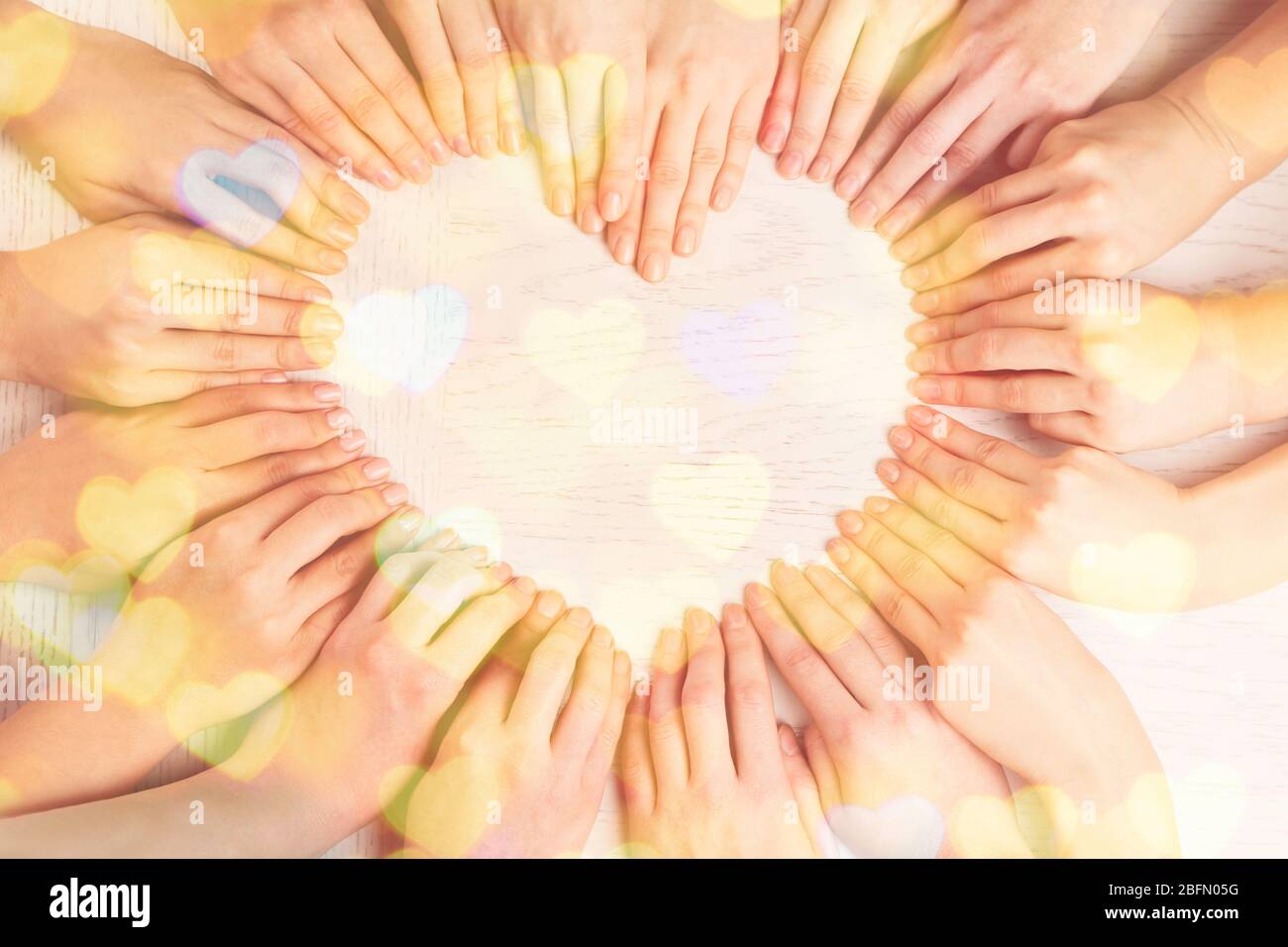 Group of people making heart symbol hi-res stock photography and images ...