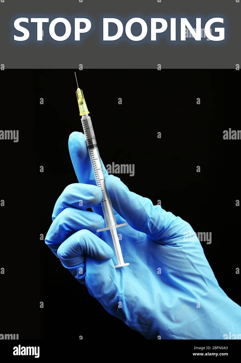 Stop doping concept. Hand in glove with syringe isolated on black Stock ...
