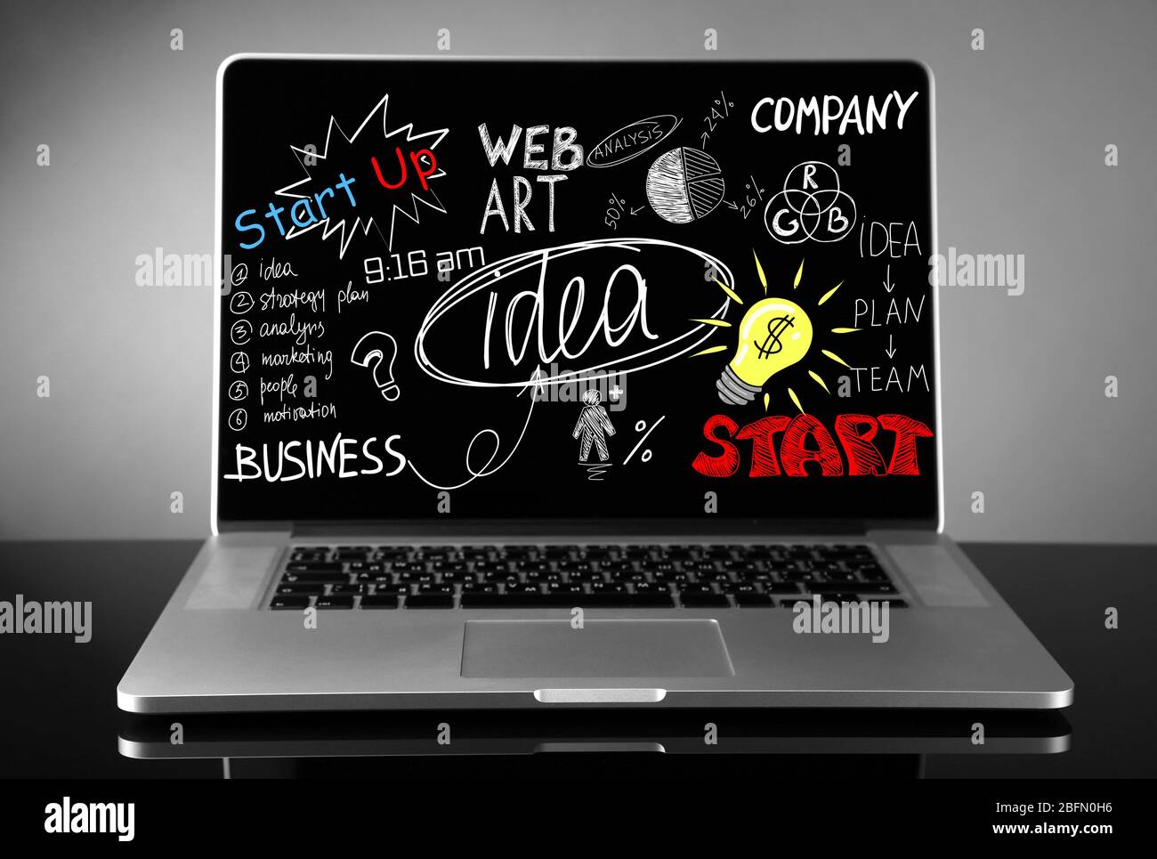 Laptop on gray background. Start up concept Stock Photo - Alamy