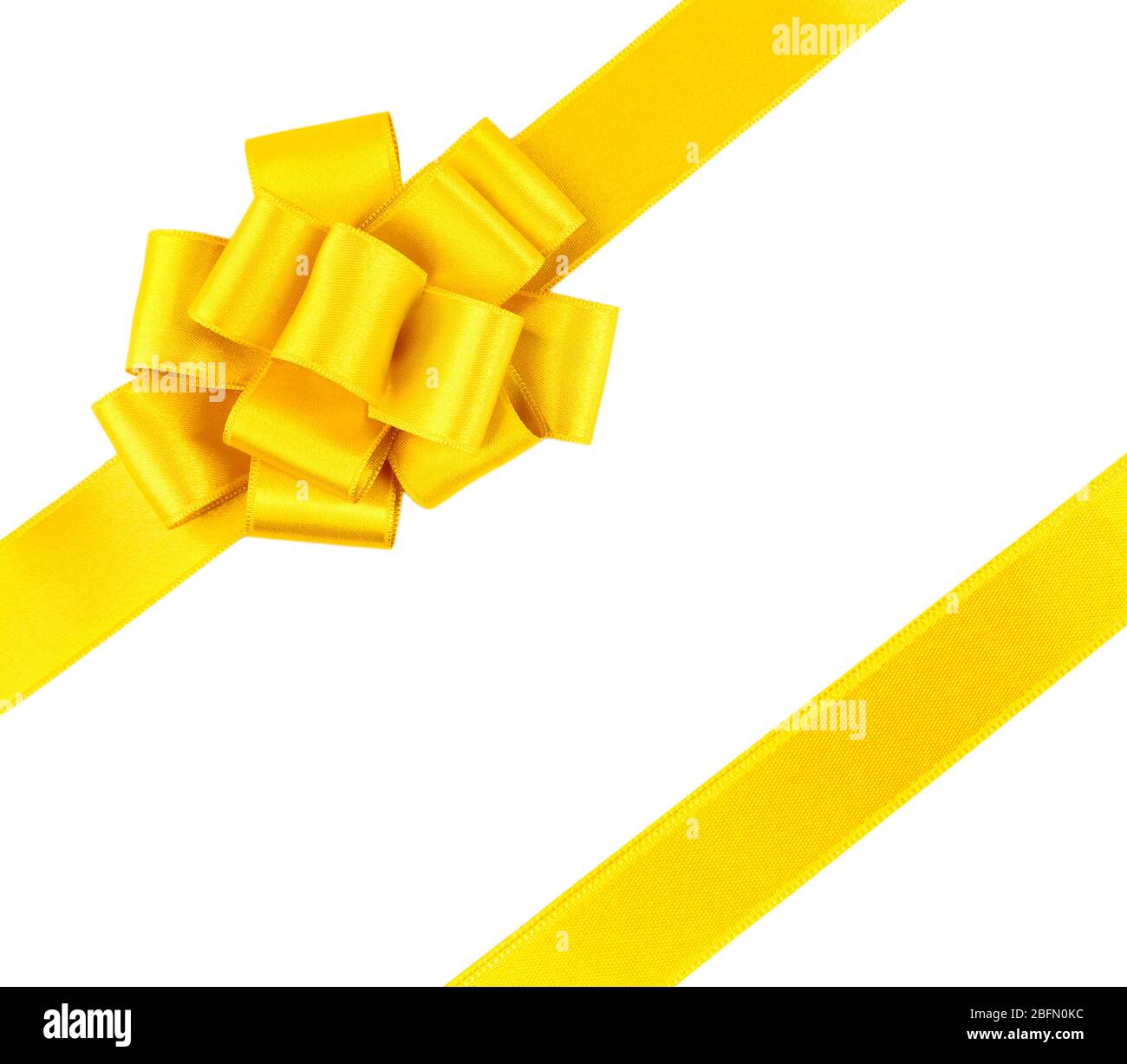 Yellow diagonal ribbons and bow, isolated on white Stock Photo - Alamy