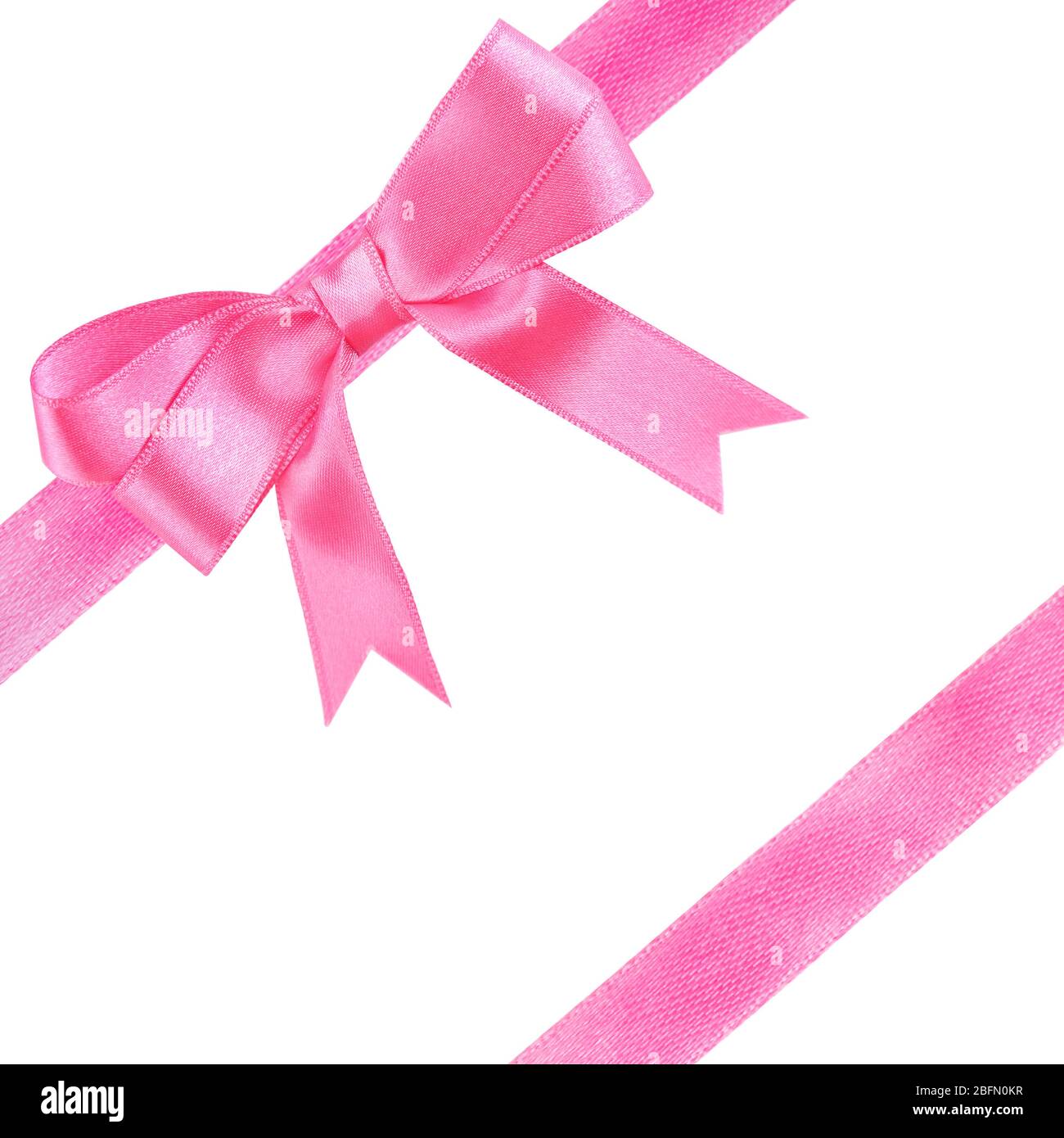 Pink diagonal ribbons and bow, isolated on white Stock Photo - Alamy