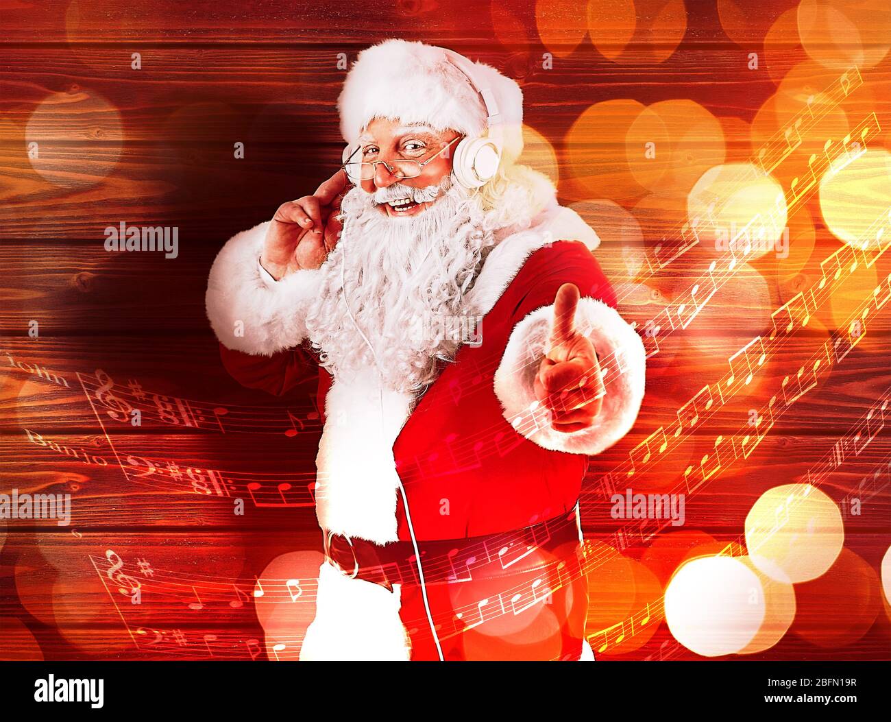 Santa Claus listening to music and showing thumbs up against abstract ...