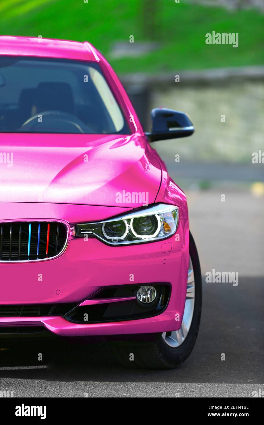 Pink car on road Stock Photo - Alamy