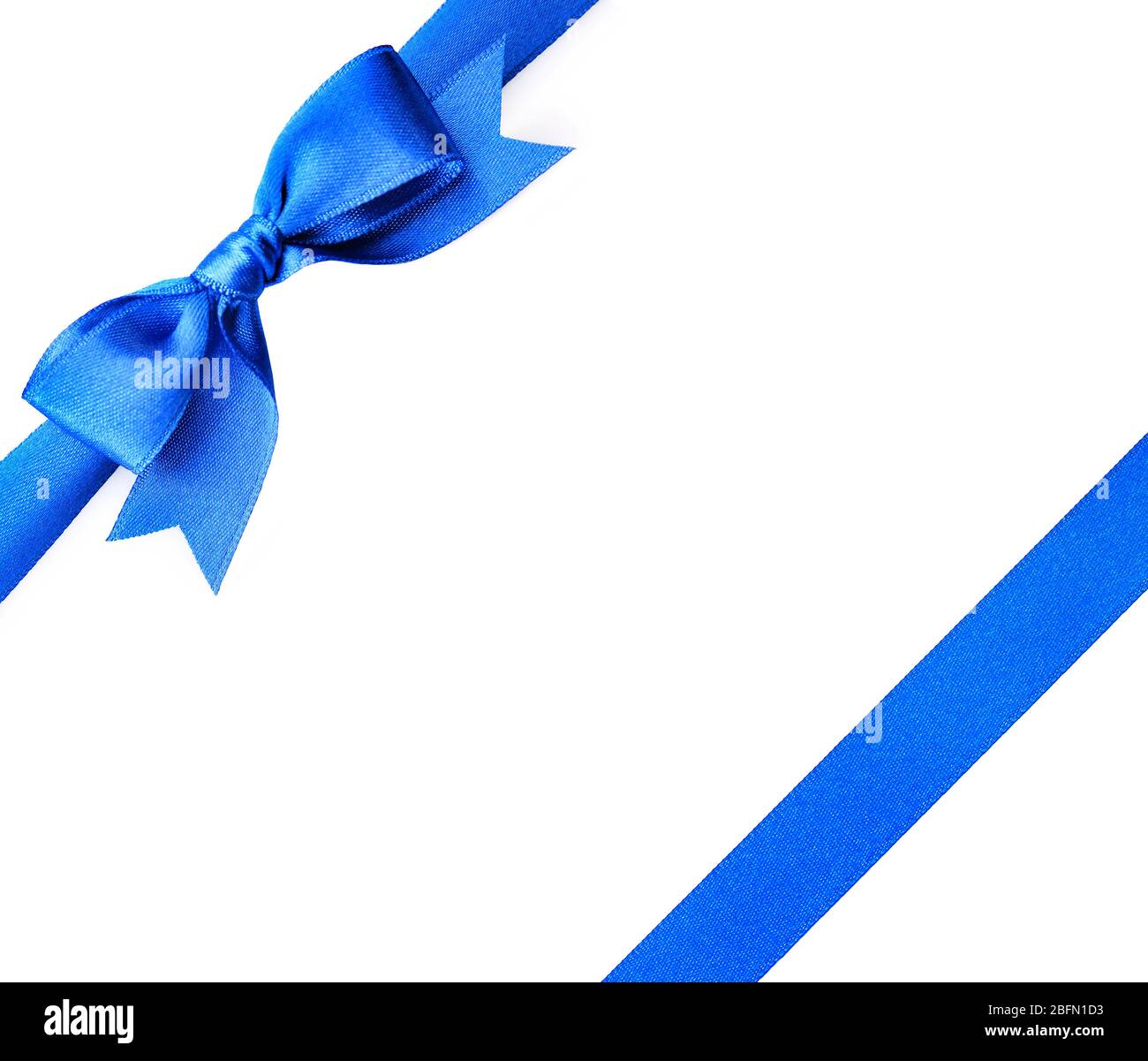 Blue diagonal ribbons and bow, isolated on white Stock Photo - Alamy