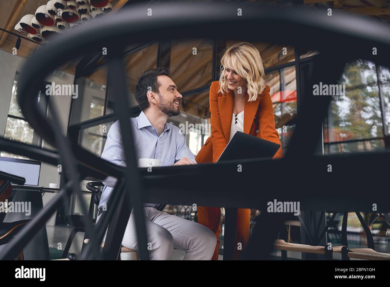 Colleague looking at other computer hi-res stock photography and images ...