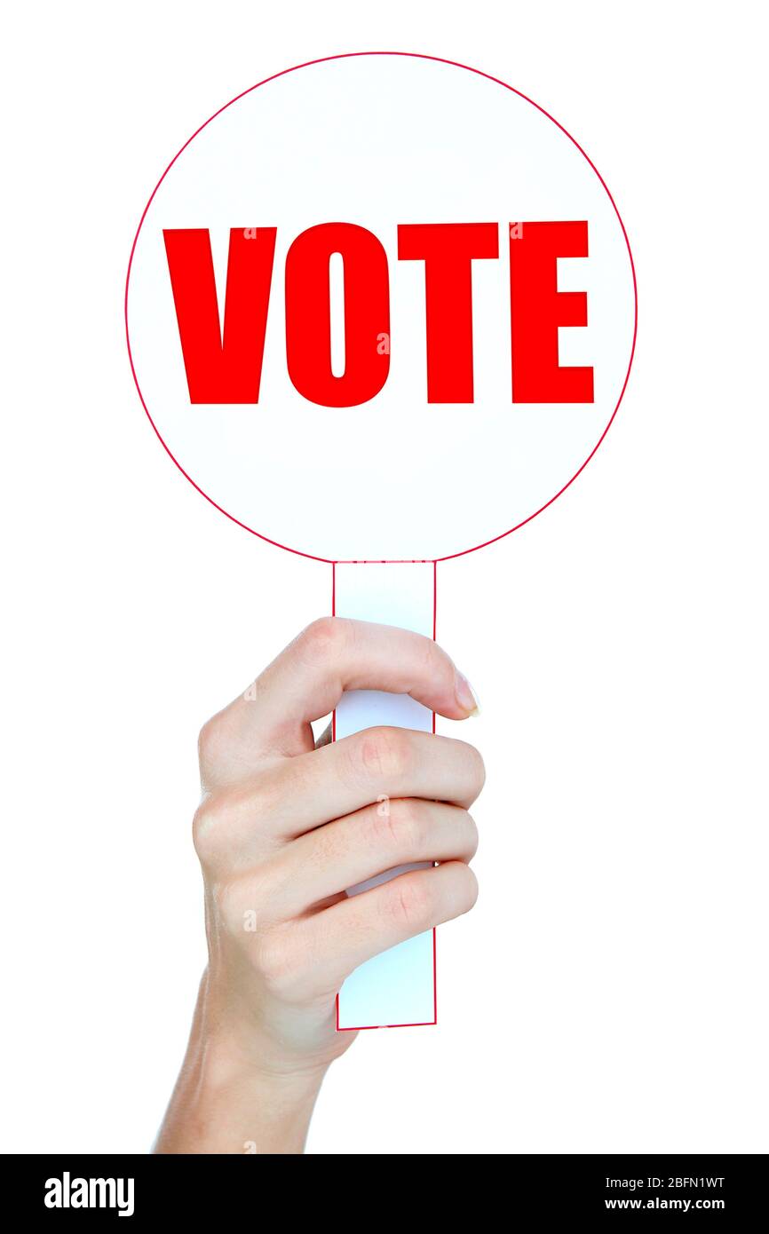 Hand holding vote sign isolated on white Stock Photo - Alamy