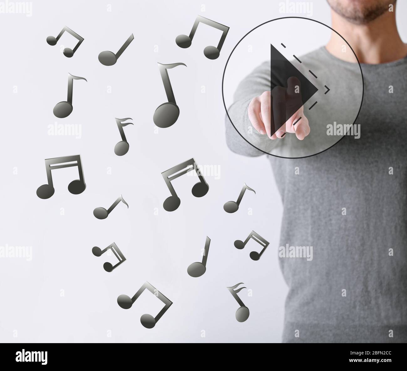 Man push play button on touch screen Stock Photo - Alamy