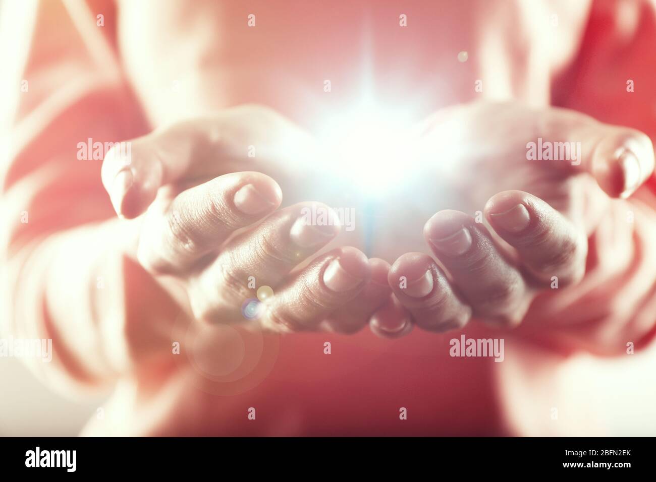Light in hands. Concept of taking, care, protection Stock Photo - Alamy