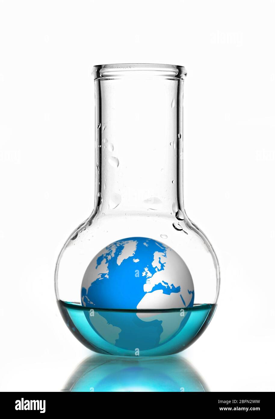 Flask with blue fluid and small Earth planet inside isolated on white ...